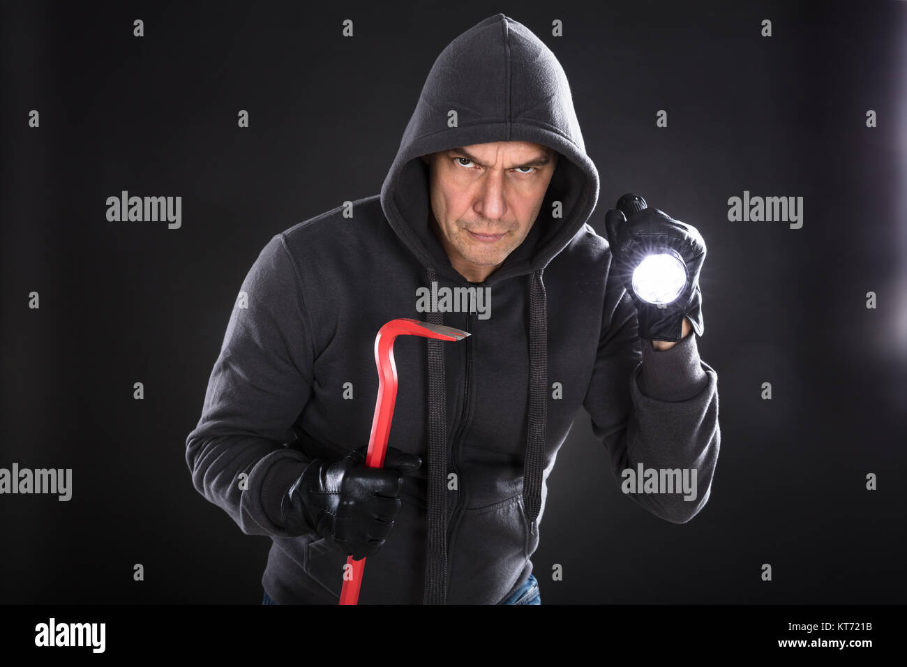 Thief criminal holding crowbar portrait hi-res stock photography and ...