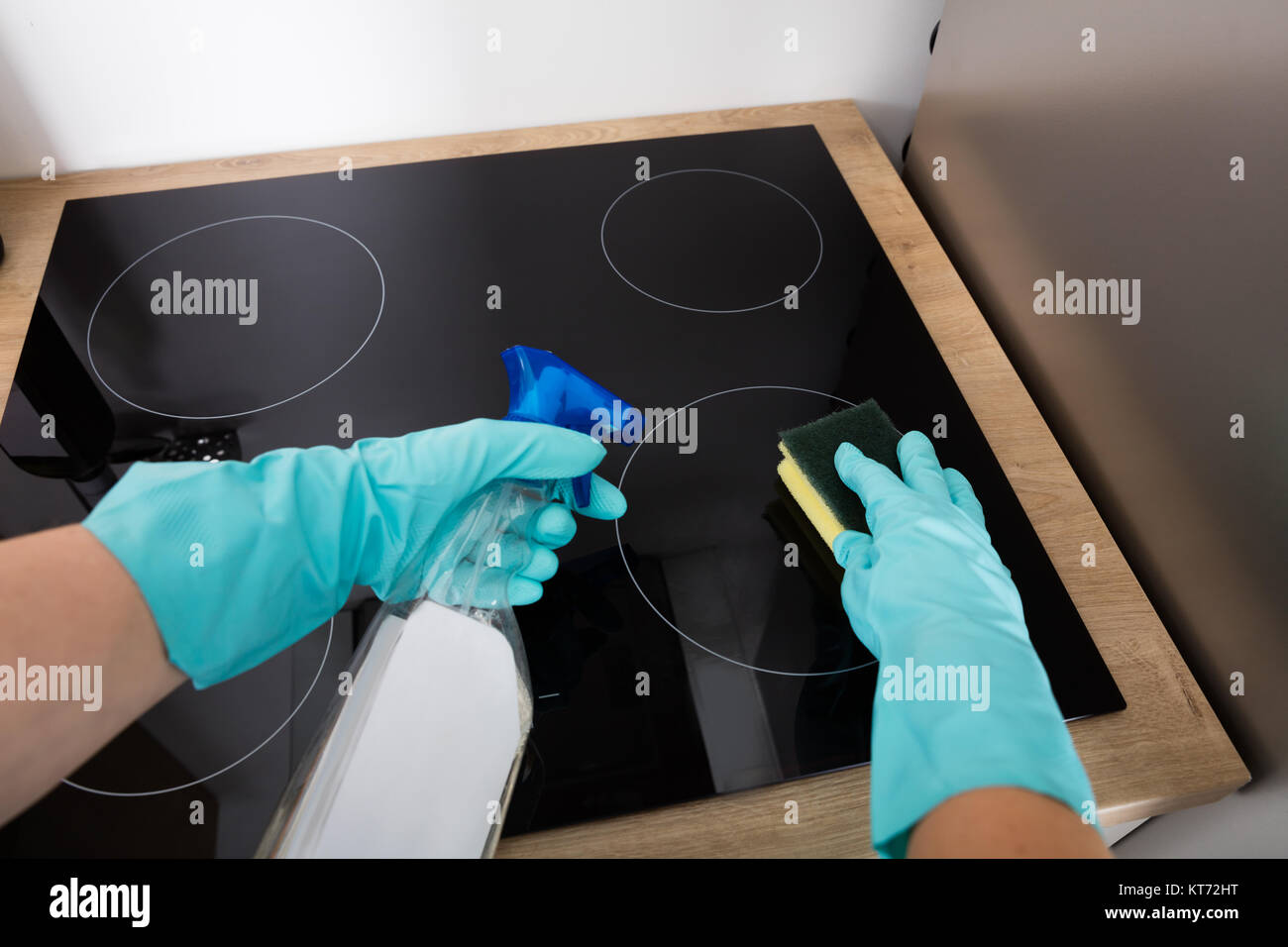 Person Hands Cleaning Induction Stove Stock Photo - Alamy