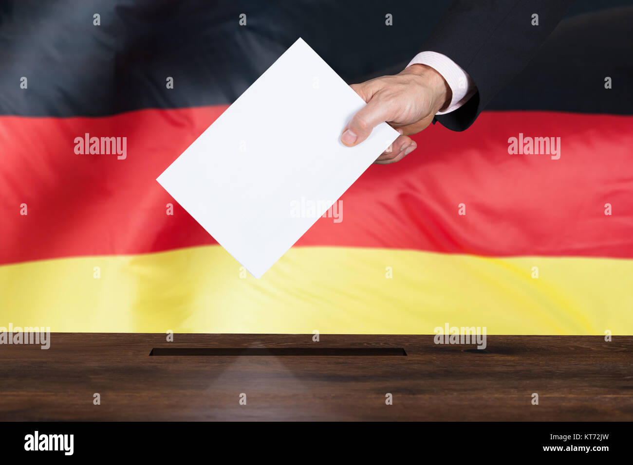 Hand putting voting bulletin hi-res stock photography and images - Alamy