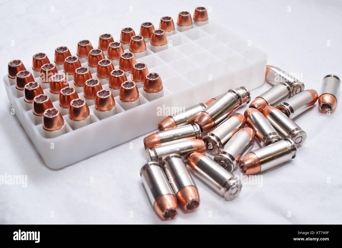 A plastic shell container holding .40 caliber hollow point bullets with ...