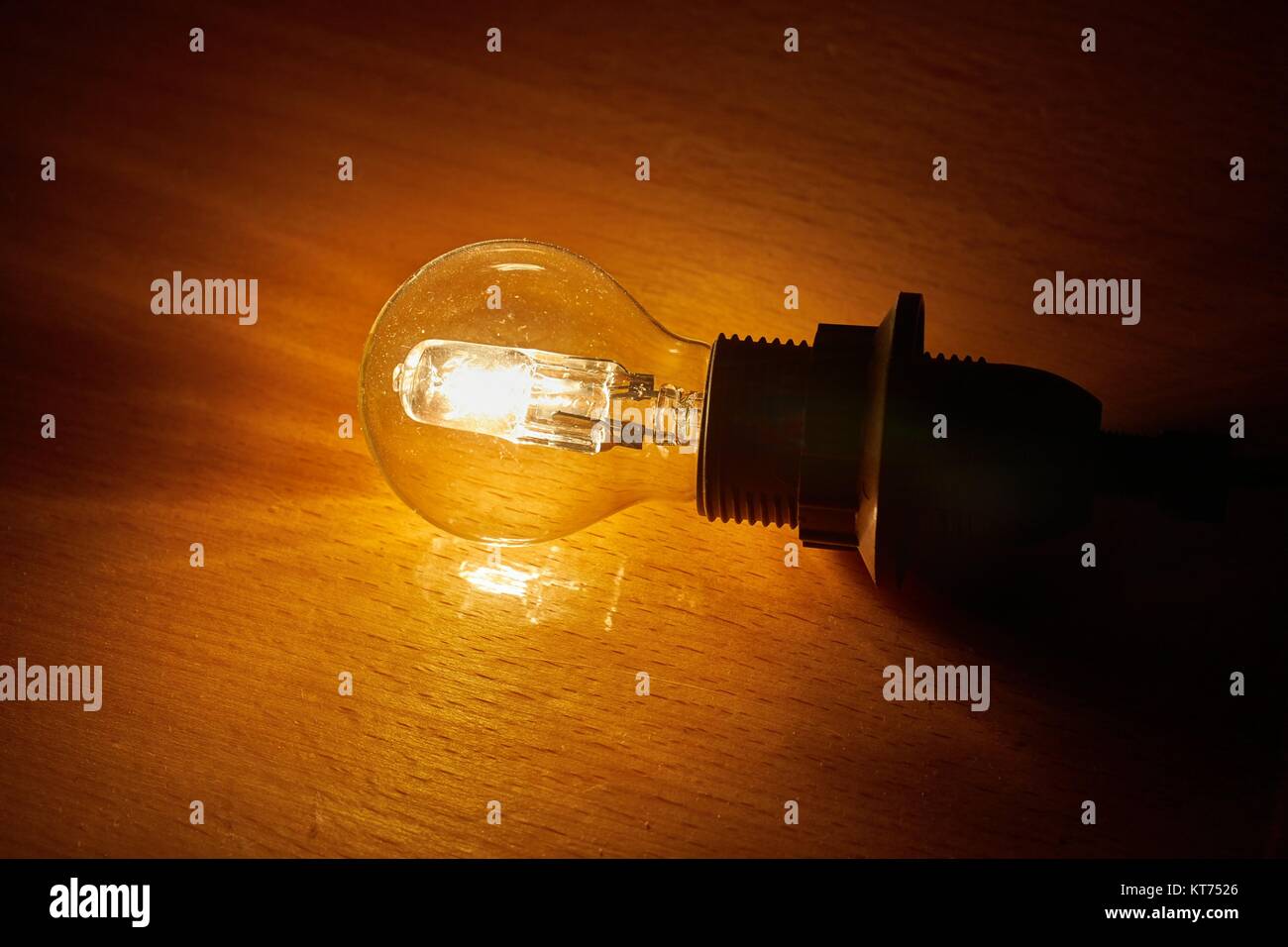 Light bulb on a table Stock Photo - Alamy