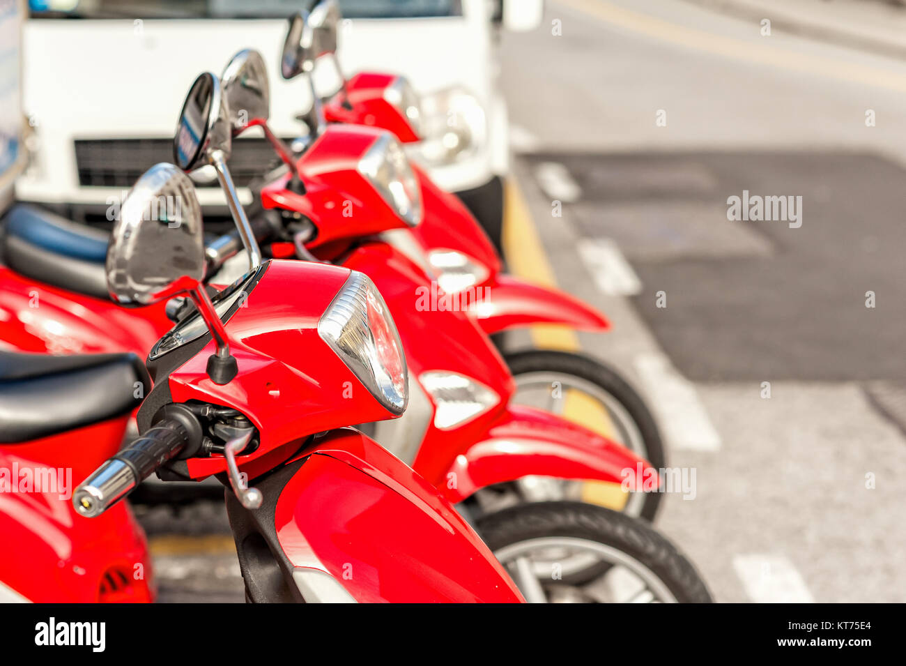 Red scooters parked in rows Stock Photo - Alamy