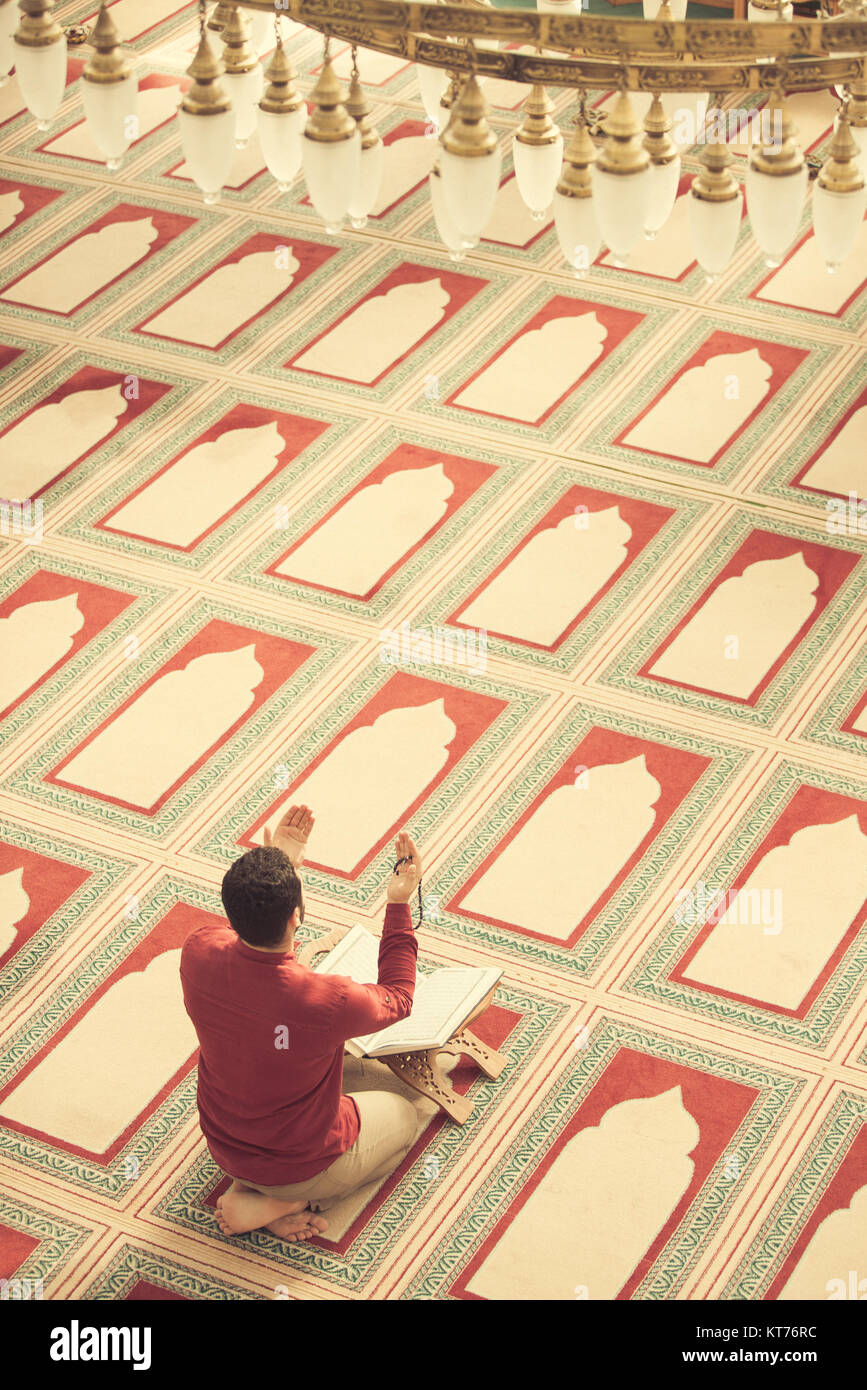 Religious muslim man praying inside the mosque Stock Photo - Alamy