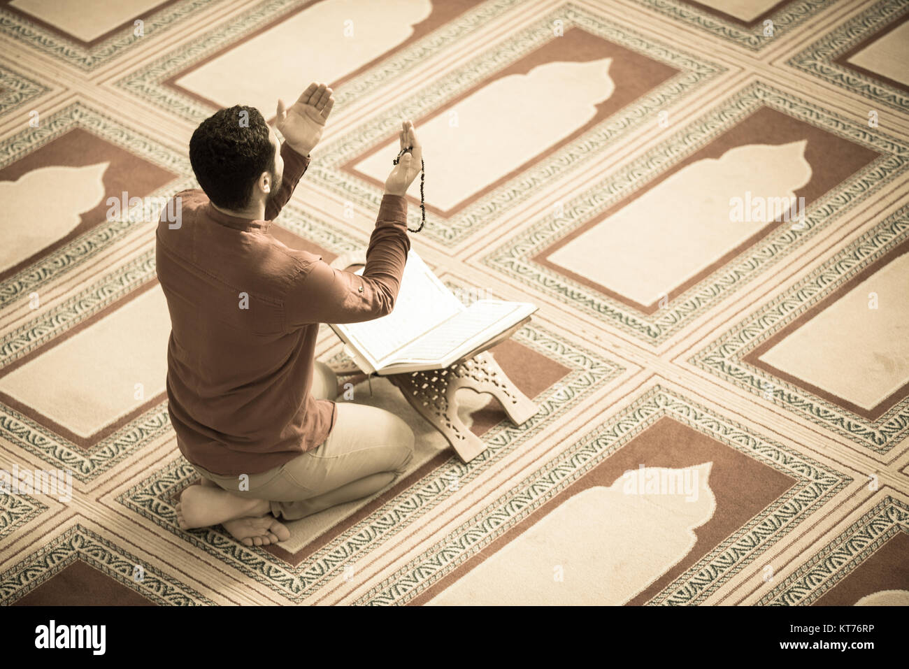 Religious muslim man praying inside the mosque Stock Photo - Alamy