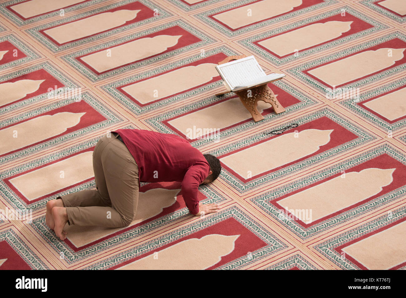 Religious muslim man praying inside the mosque Stock Photo - Alamy
