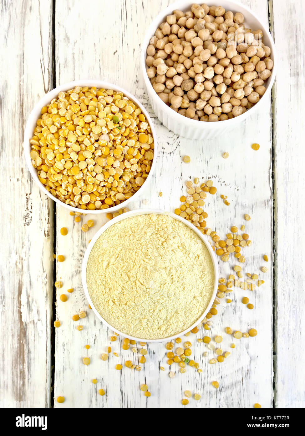 Flour pea and split pease in three bowls on board top Stock Photo - Alamy
