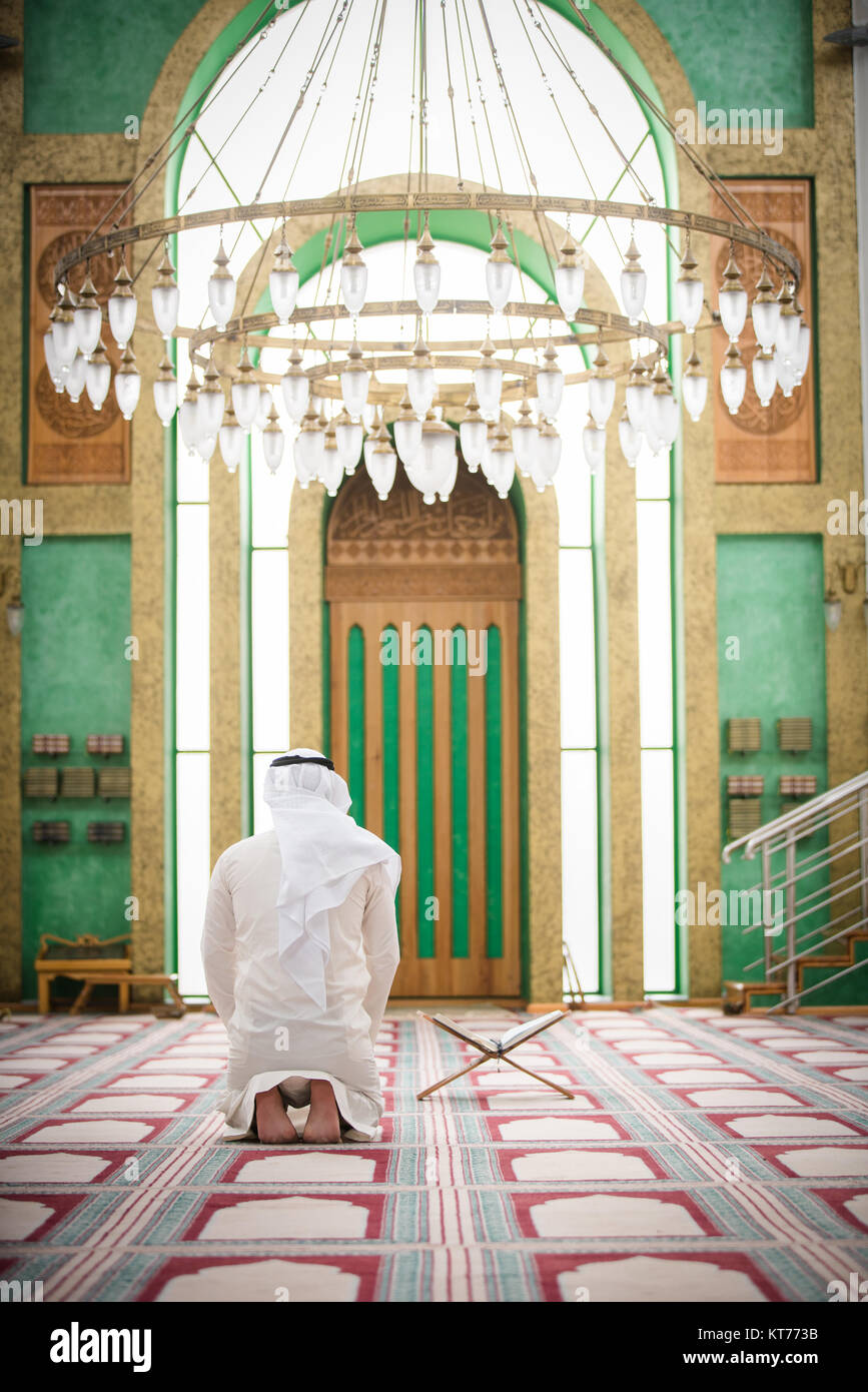 Religious muslim man praying inside the mosque Stock Photo - Alamy
