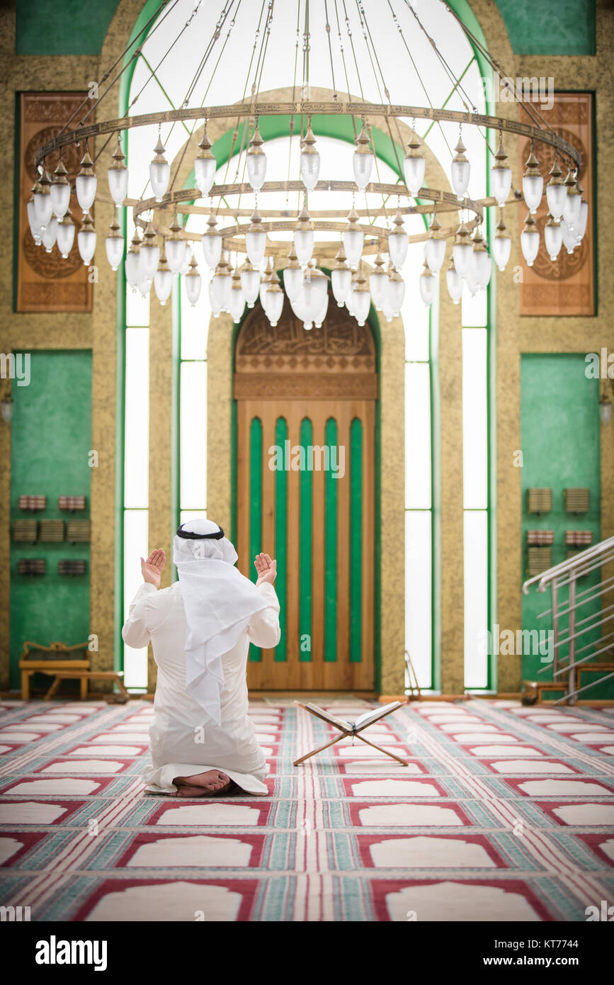 Religious muslim man praying inside the mosque Stock Photo - Alamy