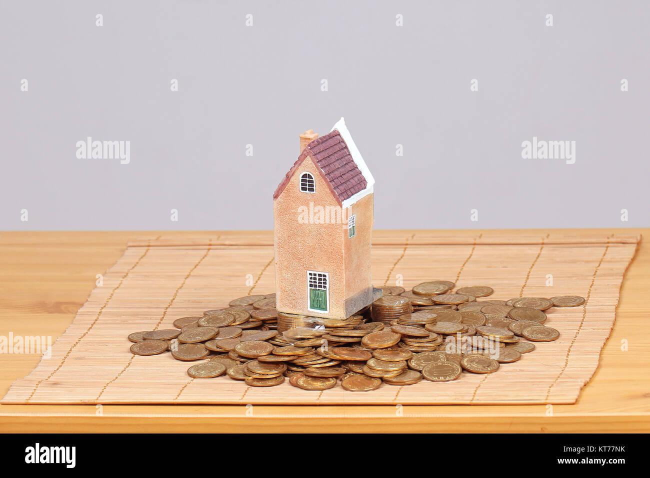 House on gold coins Stock Photo - Alamy