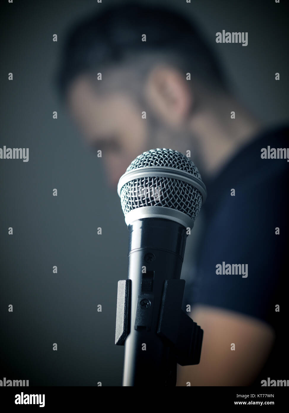 Studio microphone in front of a singer in a studio, selective focus ...
