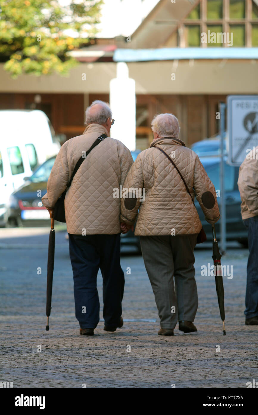senior couple in partner look walking Stock Photo - Alamy