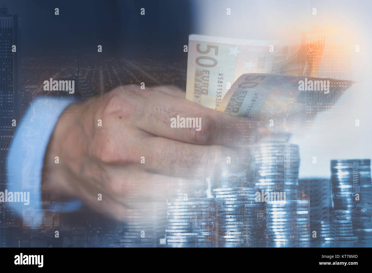 Double exposure of businessman with money in his hands and construction ...