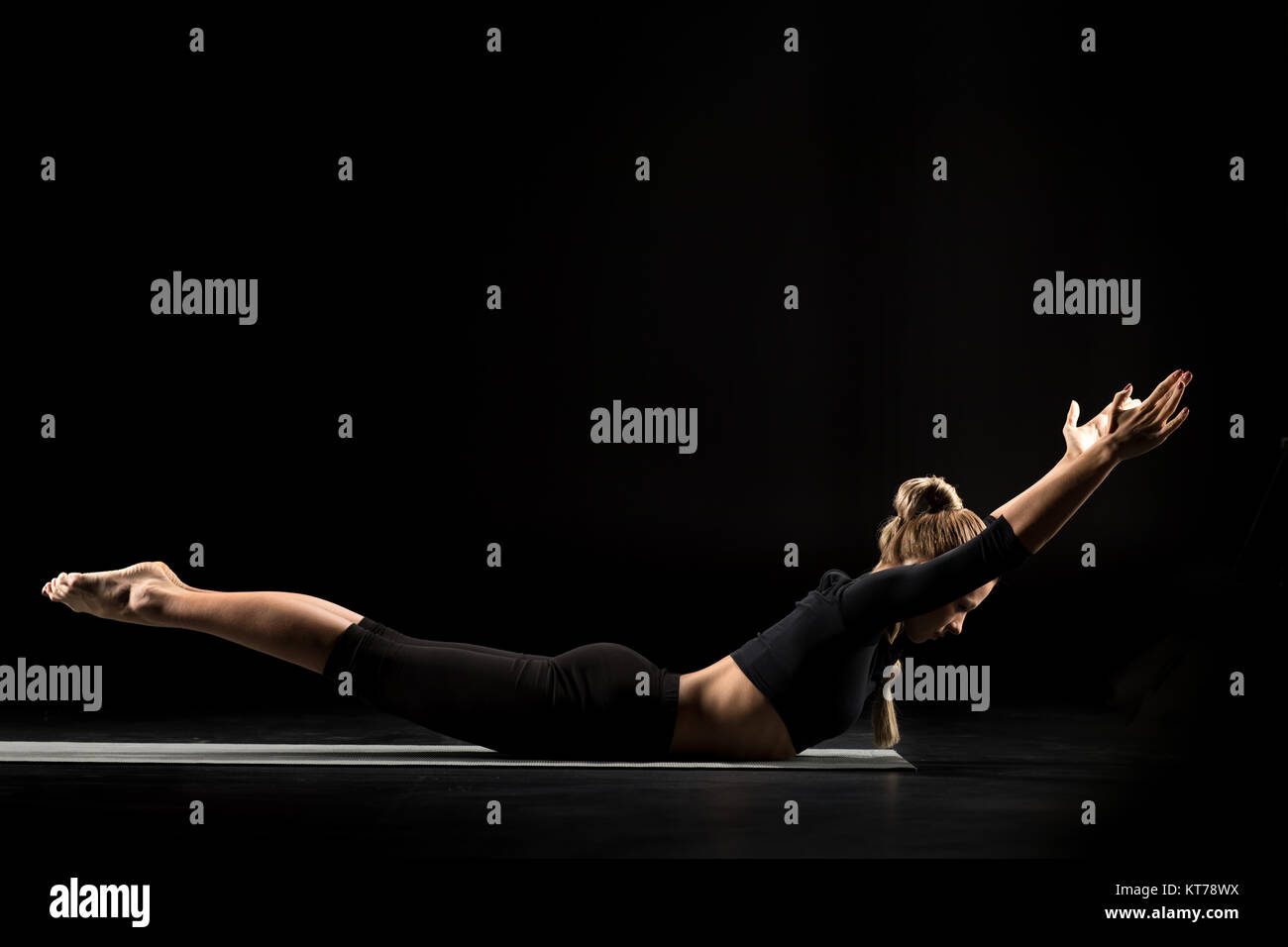 Woman lying in yoga position Stock Photo - Alamy