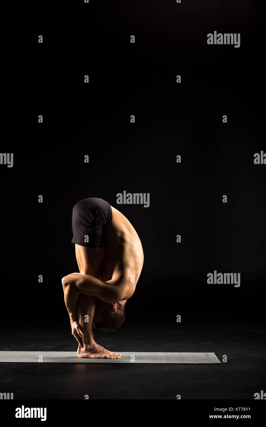 Man standing in yoga position Stock Photo - Alamy
