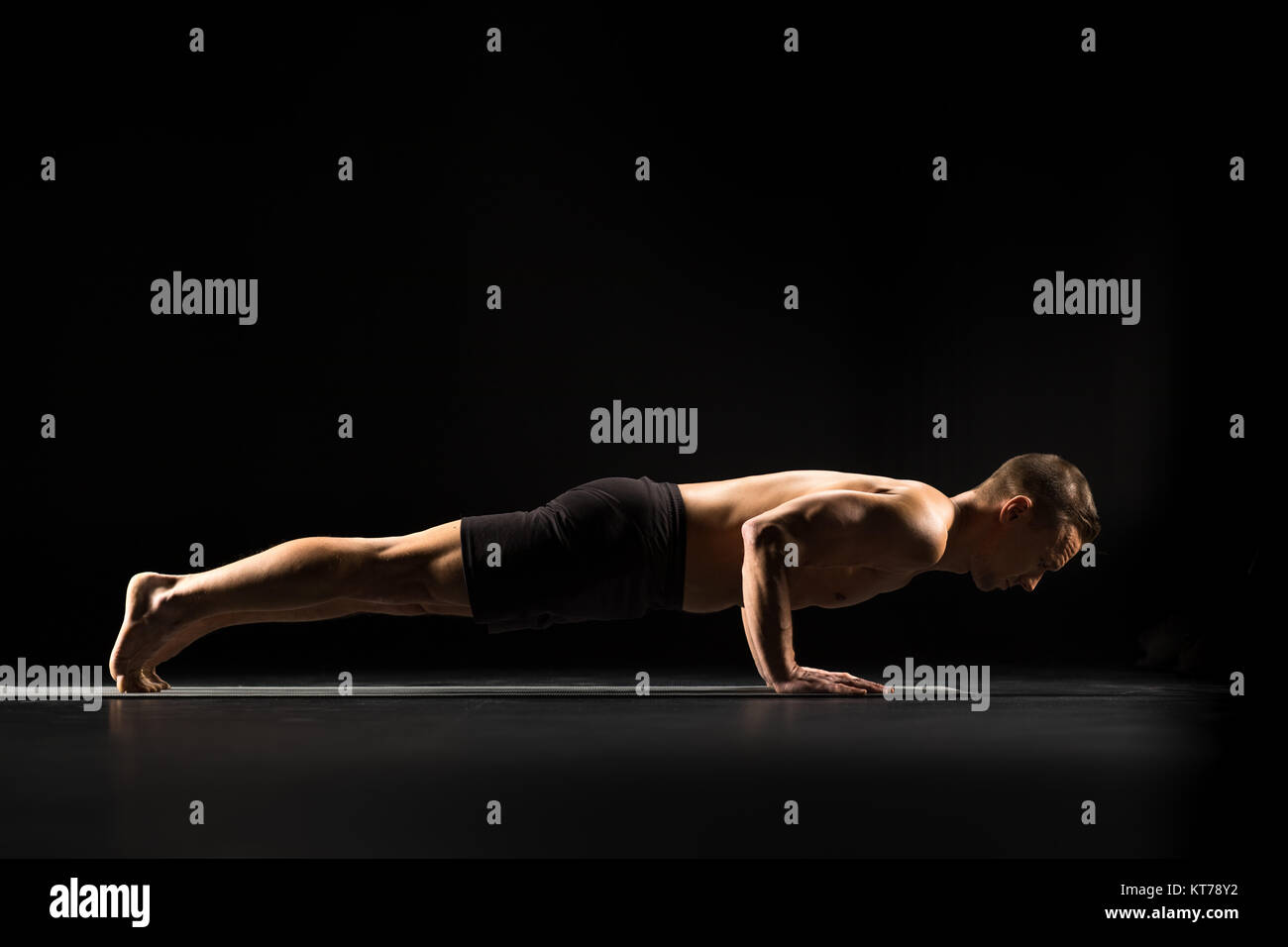 Man standing in yoga position Stock Photo - Alamy