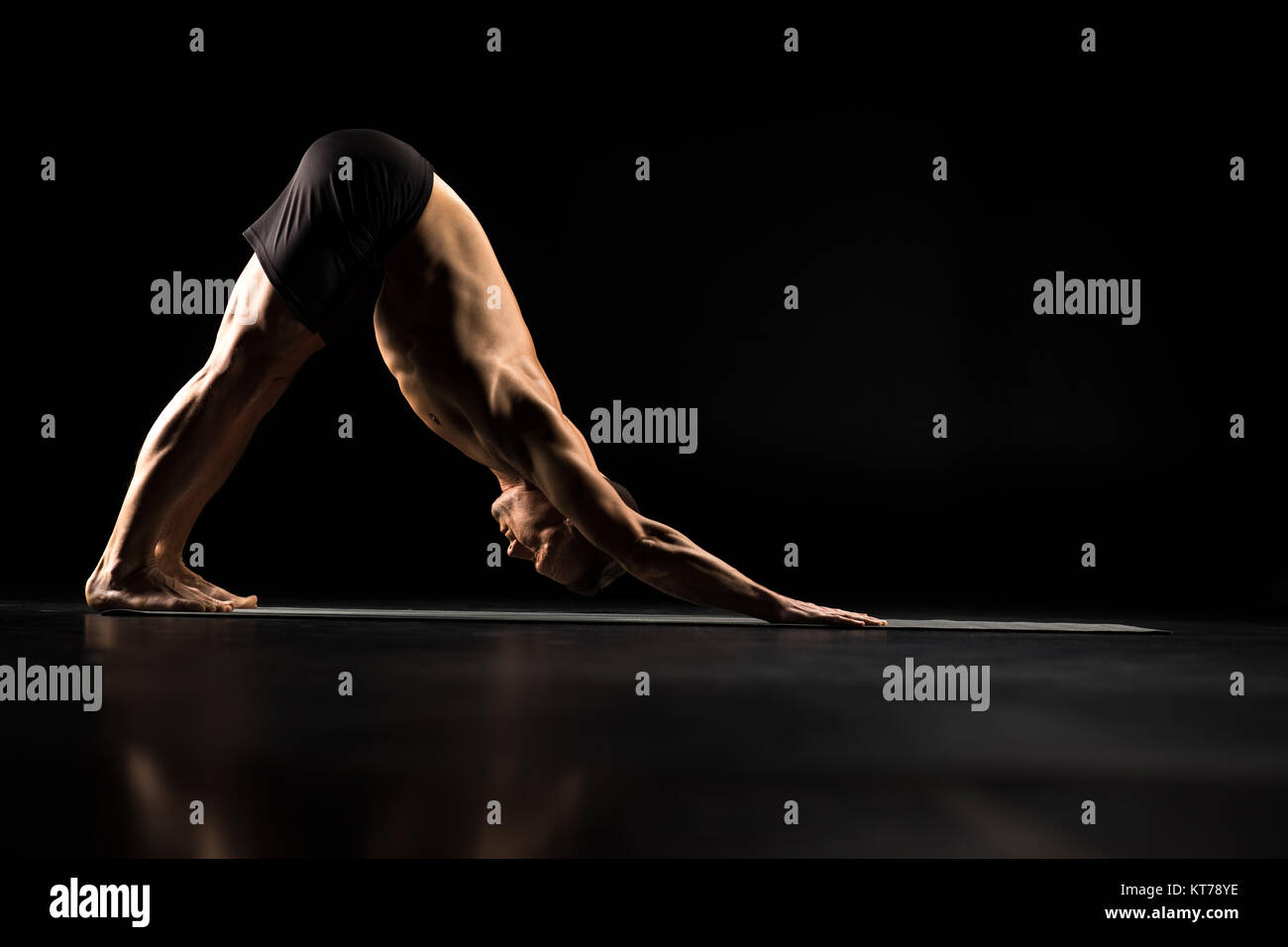 Man standing in yoga position Stock Photo - Alamy