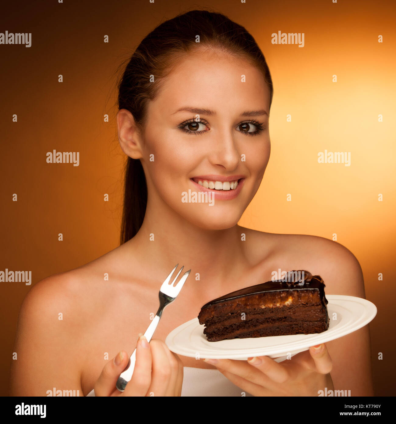 chocolate cake - glamorous woman eats dessert Stock Photo - Alamy