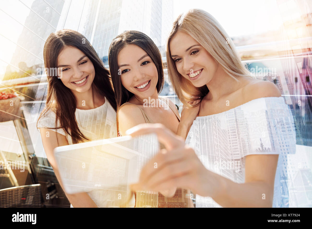 Joyful happy women looking into the camera Stock Photo - Alamy