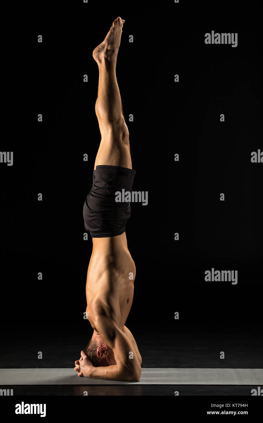 Man standing in yoga position Stock Photo - Alamy
