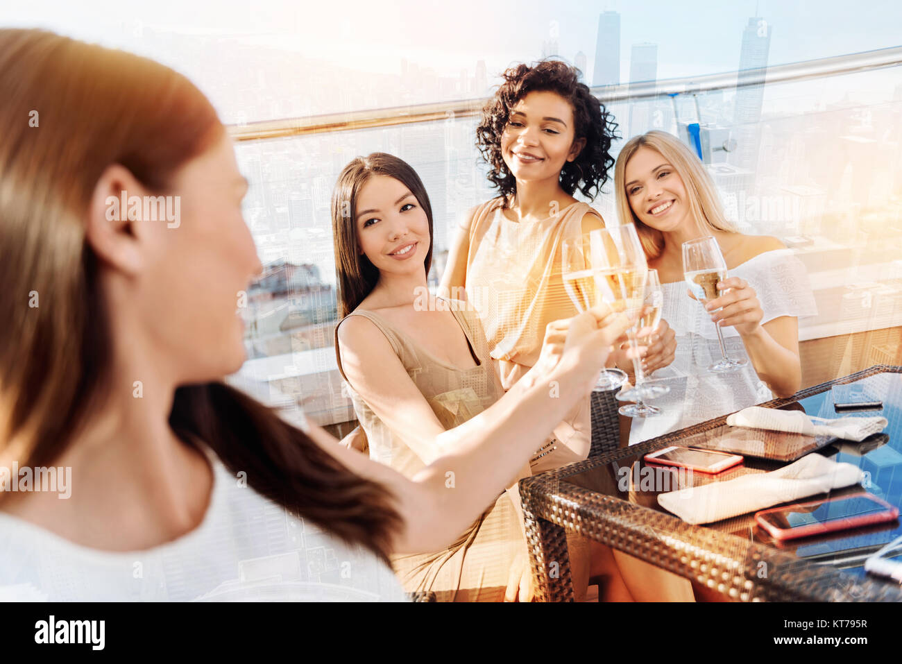 Happy delighted women cheering with sparkling wine Stock Photo - Alamy