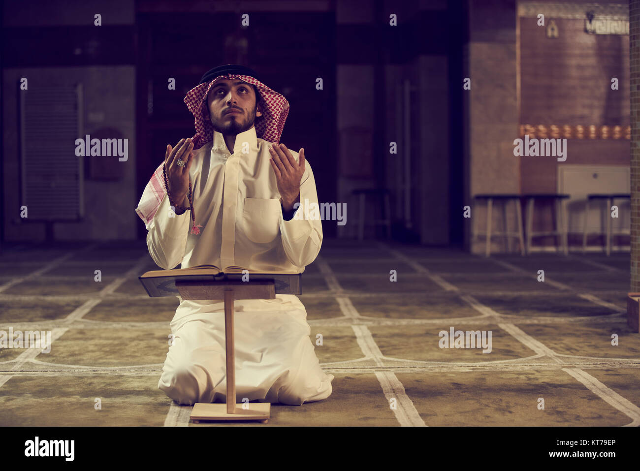 Religious muslim man praying inside the mosque Stock Photo - Alamy