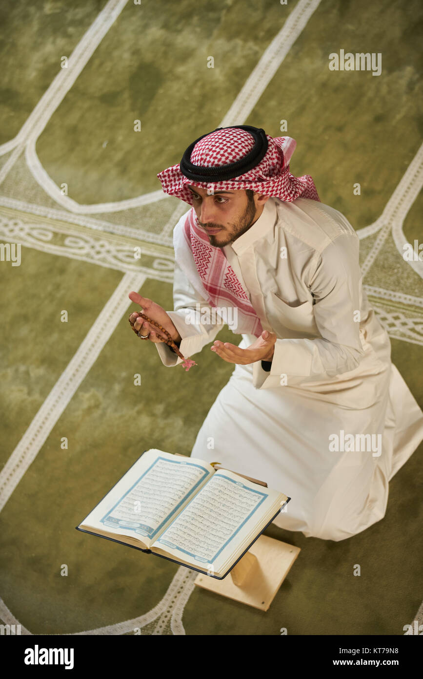 Religious muslim man praying inside the mosque Stock Photo - Alamy