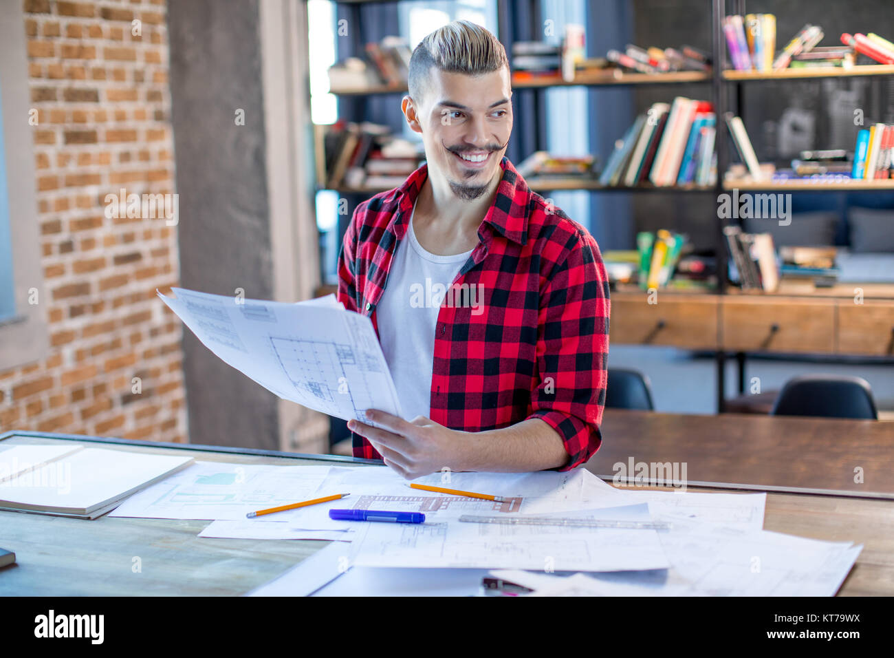 Male architect with blueprints Stock Photo - Alamy