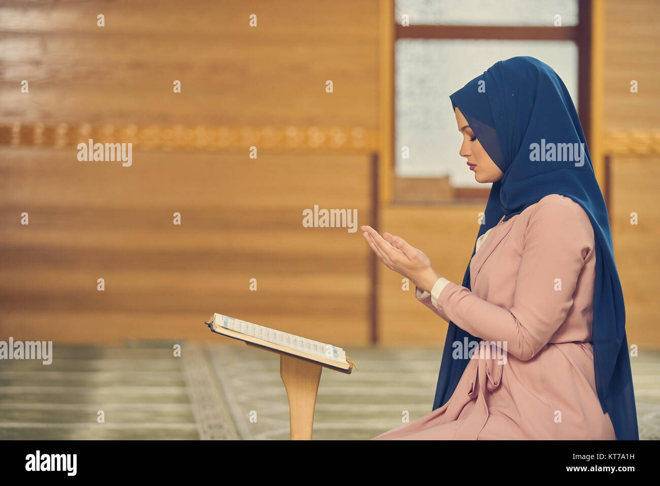 Young muslim woman praying in mosque Stock Photo - Alamy