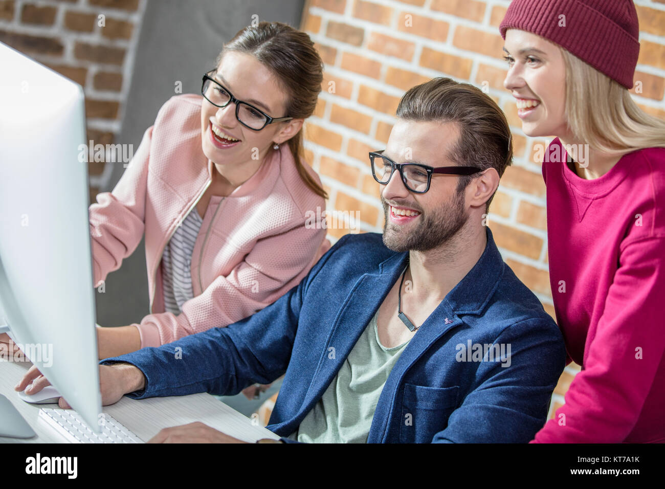 Businesspeople working with computer Stock Photo - Alamy