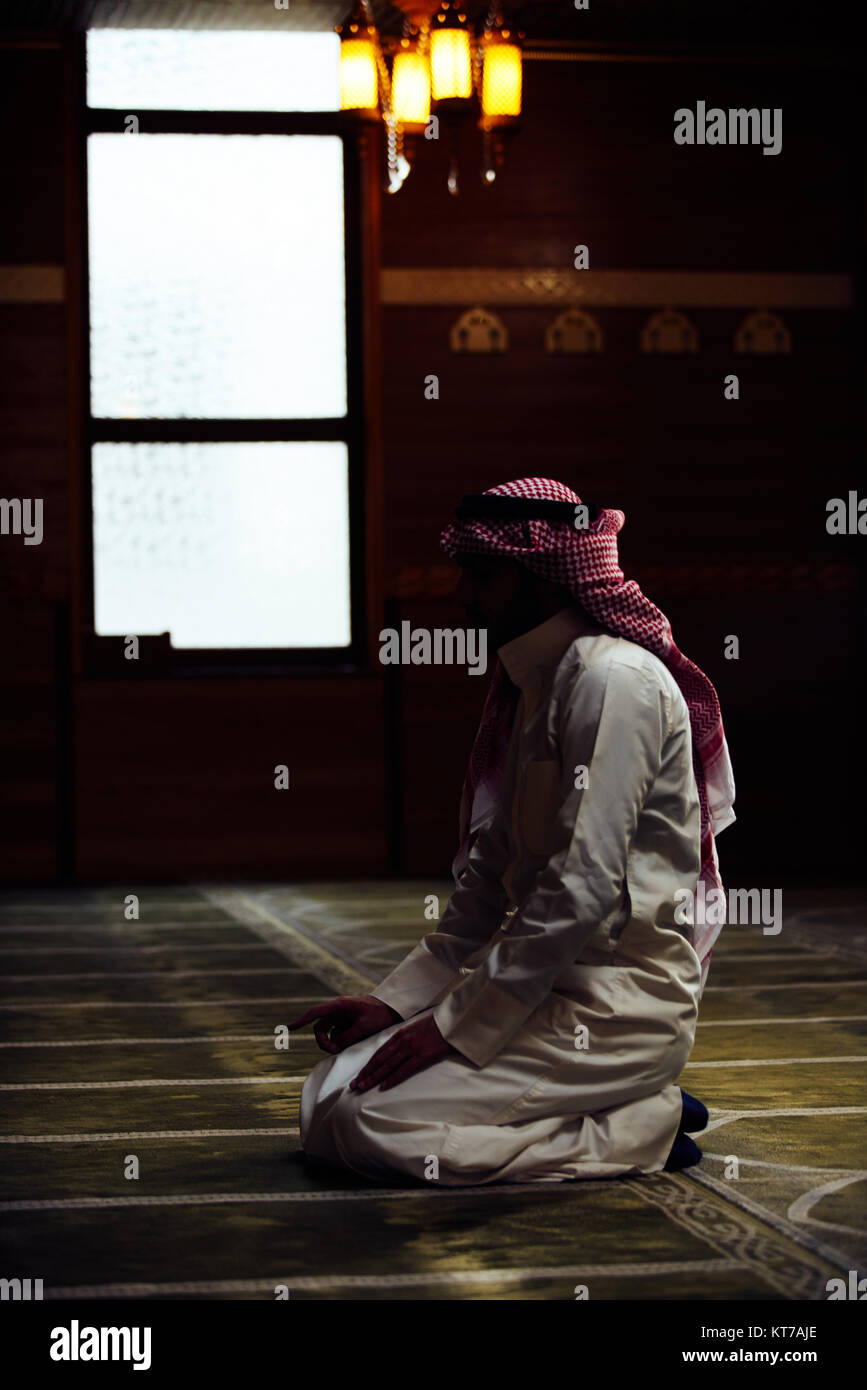 Religious muslim man praying inside the mosque Stock Photo - Alamy