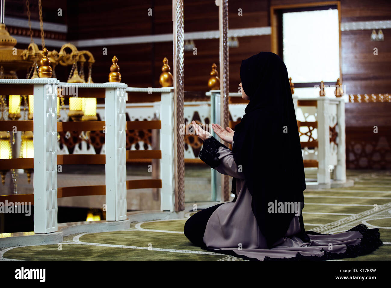 Young muslim woman praying in mosque Stock Photo - Alamy