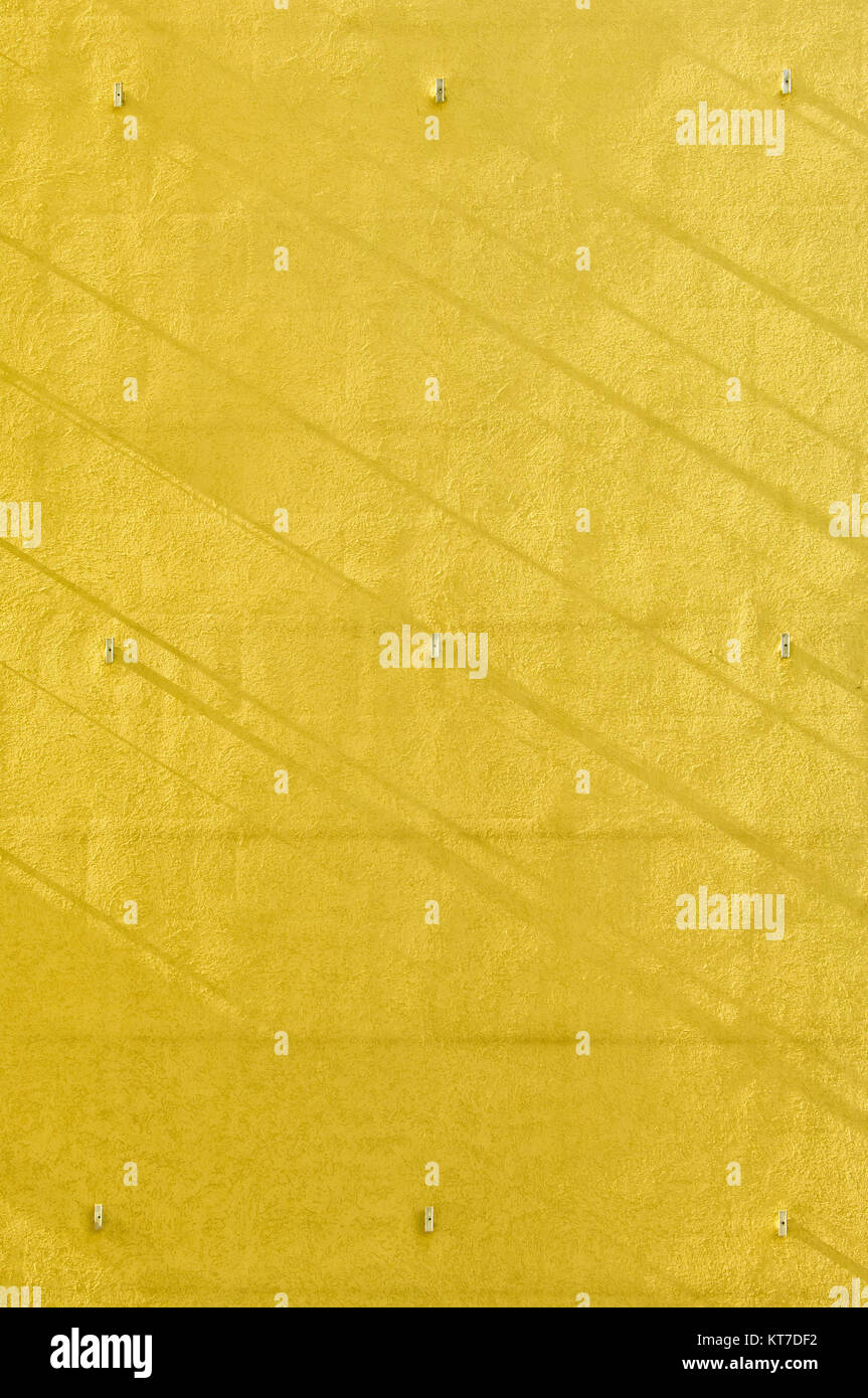 Yellow wall background with shadow strips Stock Photo - Alamy