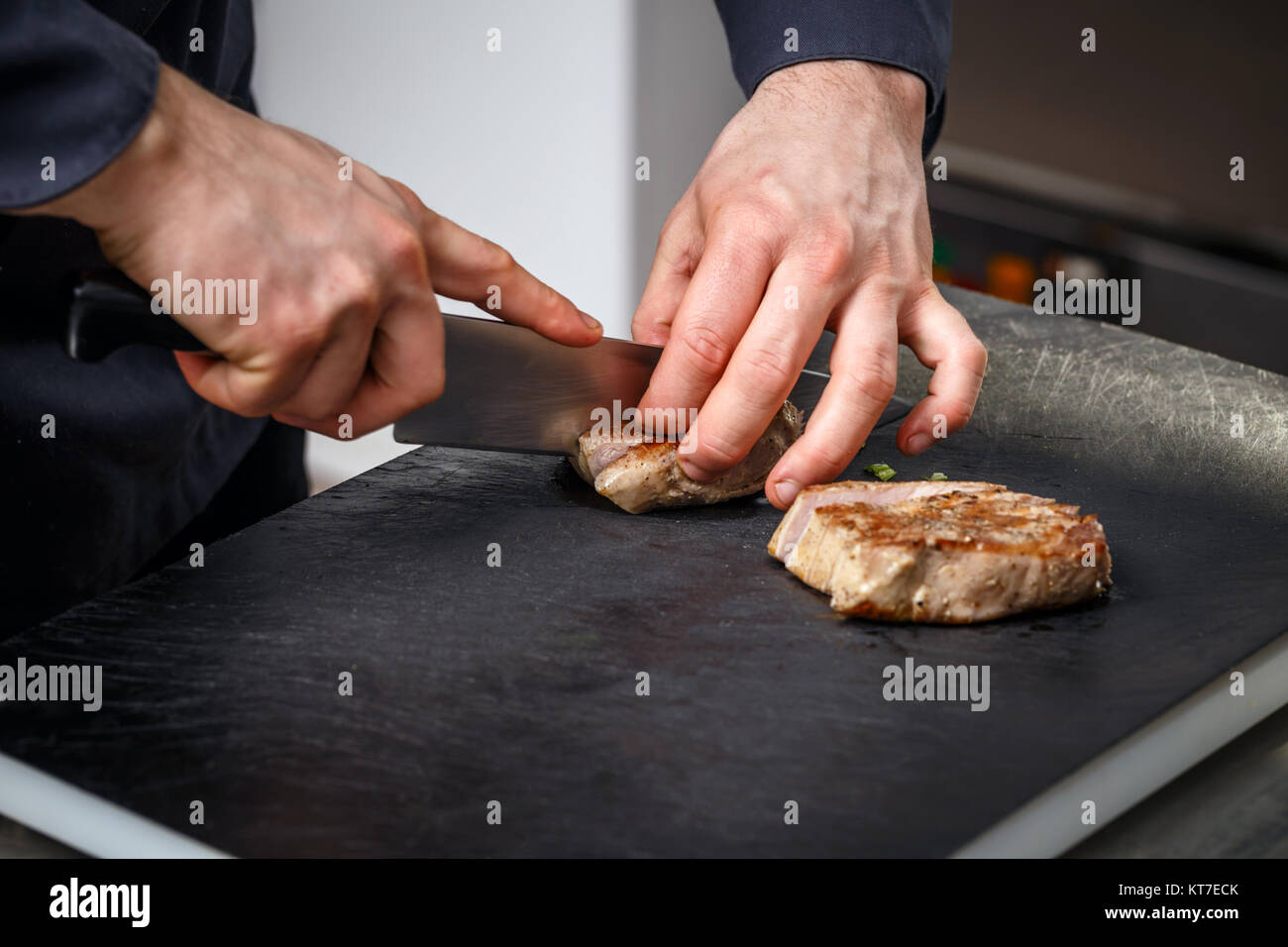 Chef cutting meat Stock Photo - Alamy