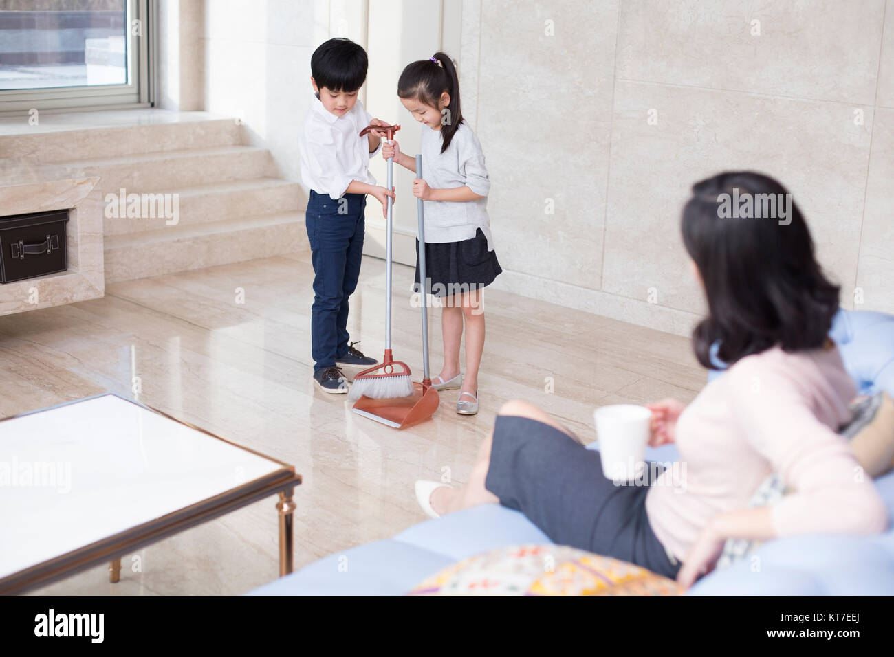 Children sweeping hi-res stock photography and images - Alamy