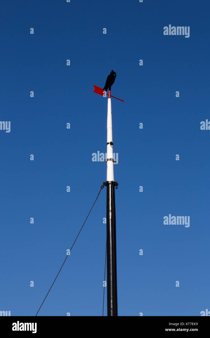 mast with stylized bird and wind vane Stock Photo - Alamy