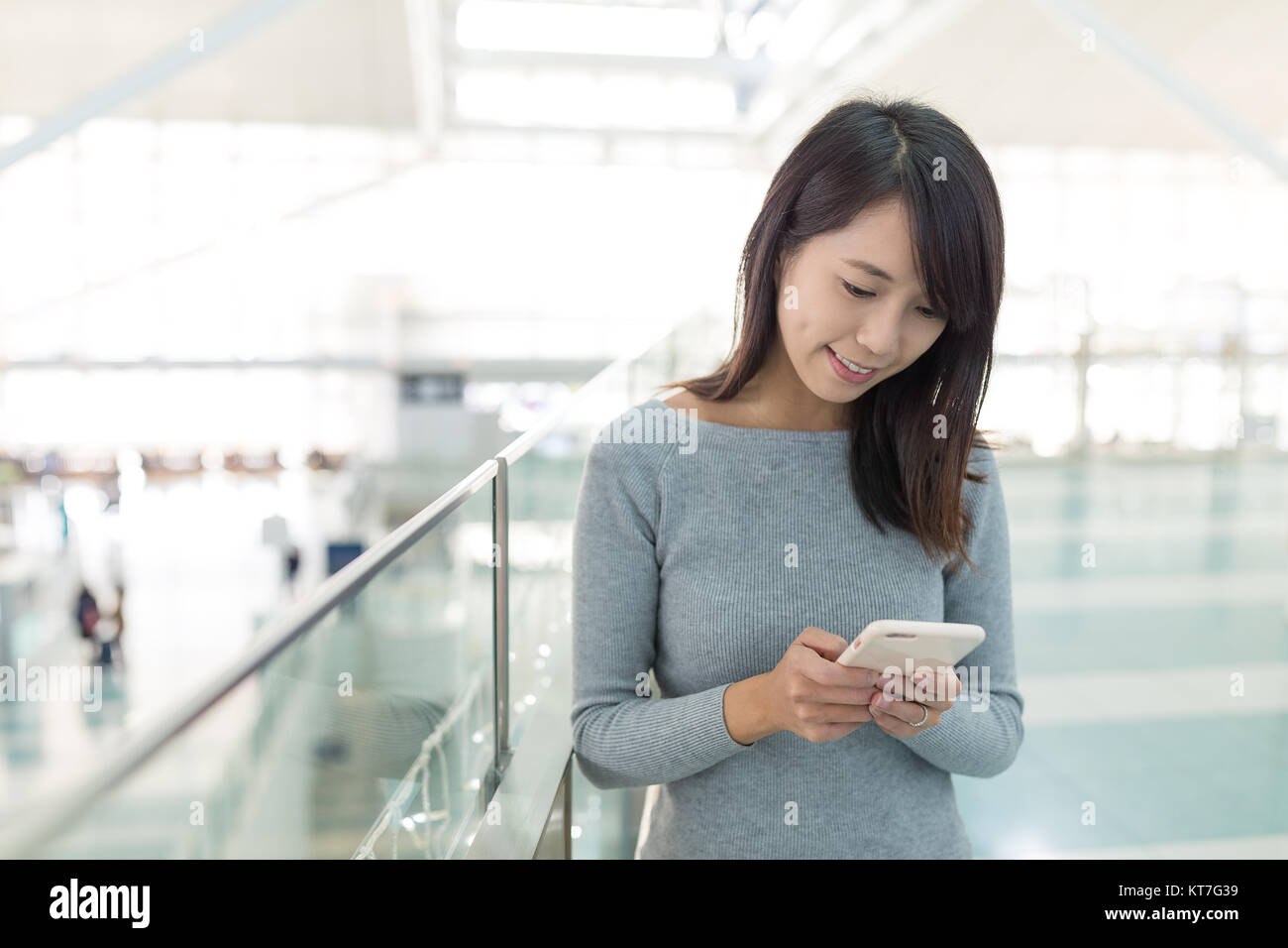 Watching mobile phone on plane hi-res stock photography and images - Alamy