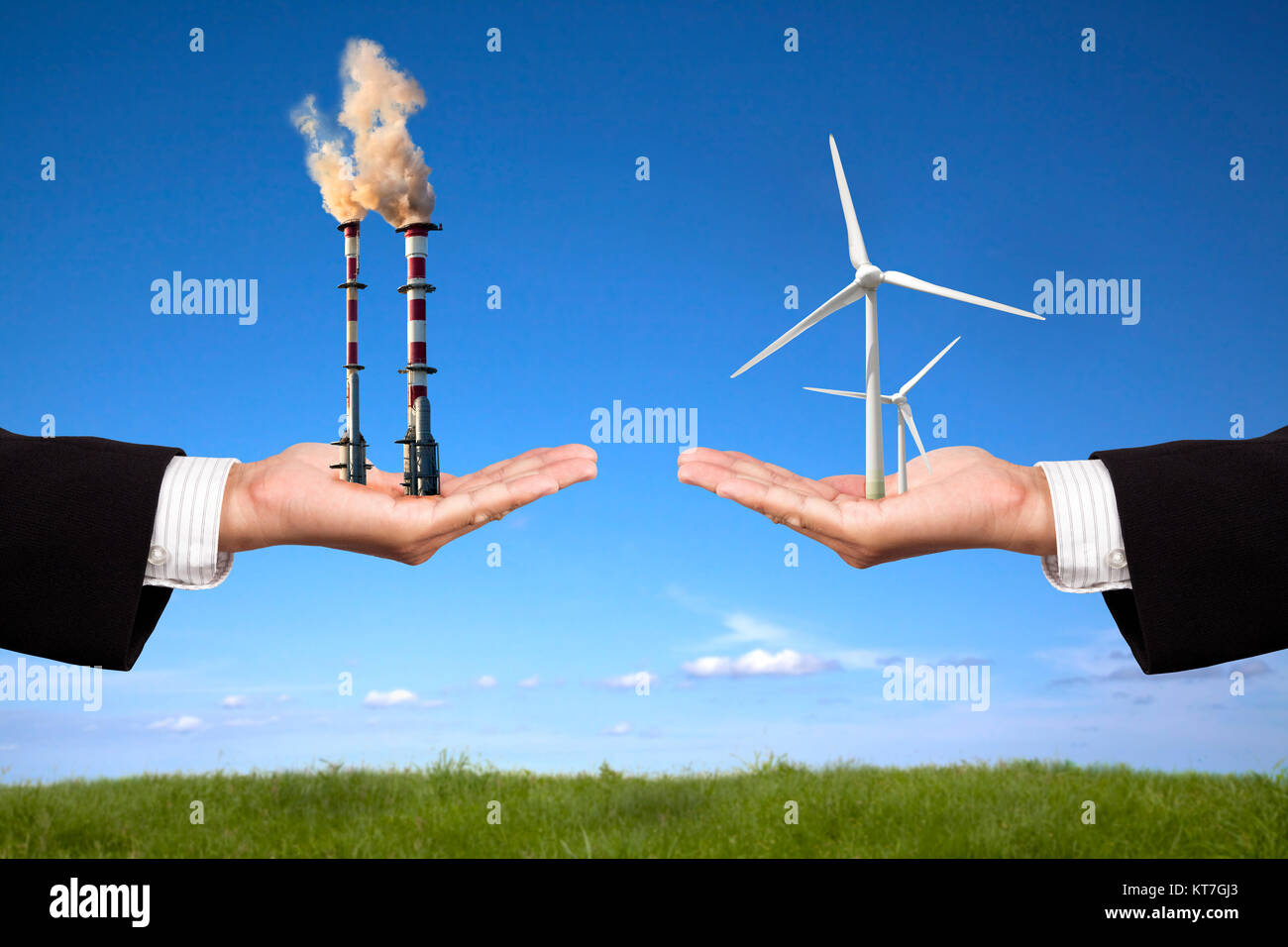 pollution and clean energy concept. businessman holding windmills and ...