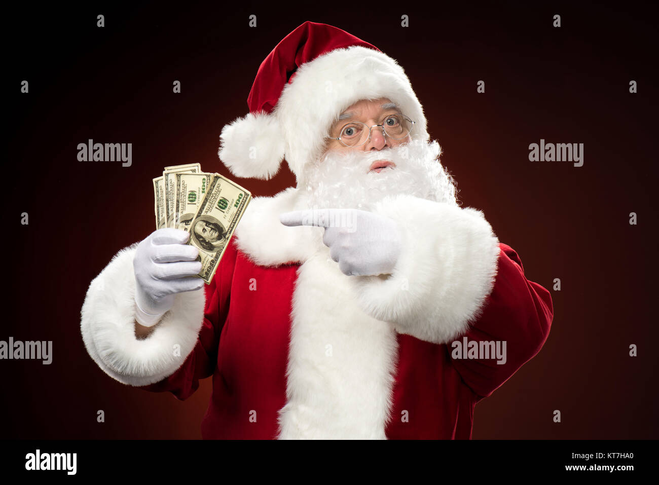 Santa Claus with dollars Stock Photo - Alamy