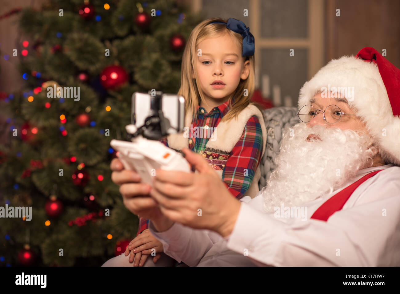 Santa Claus with little kid Stock Photo - Alamy