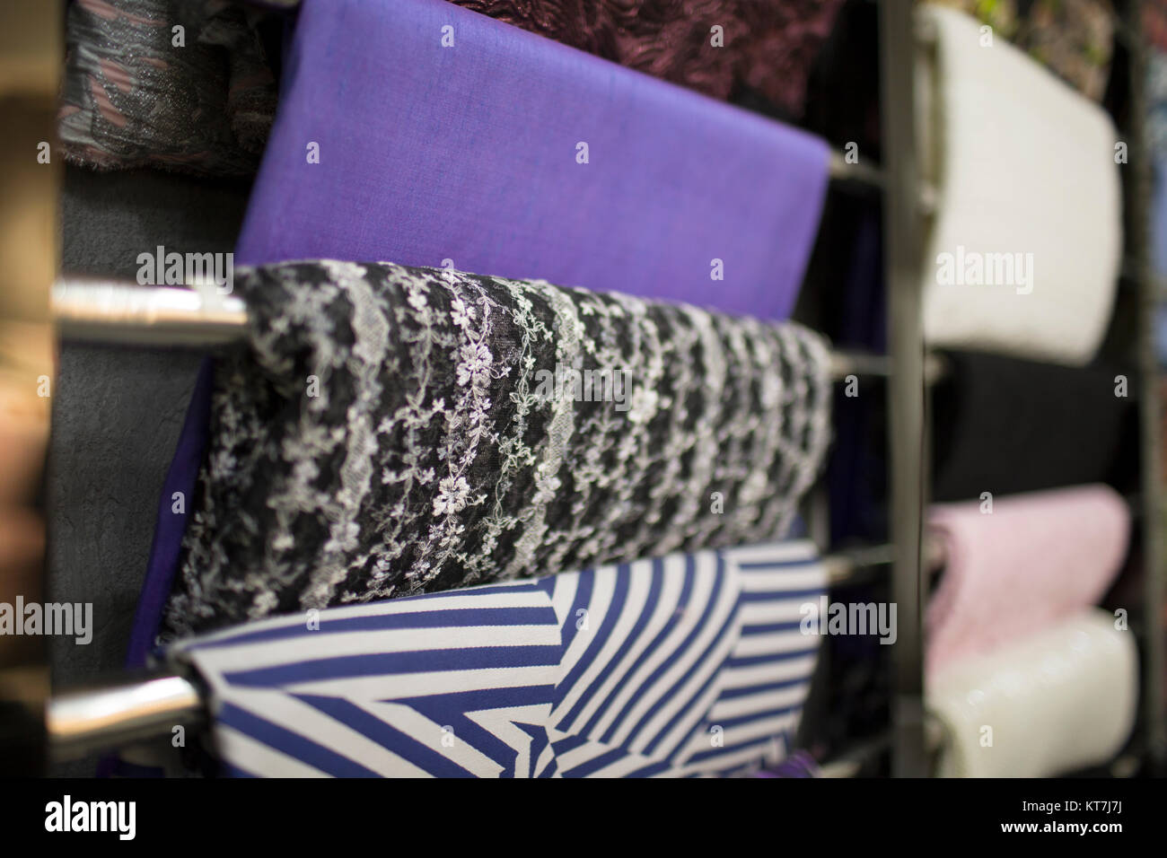 Different fabric swatches hanging on a designer’s material rack Stock ...