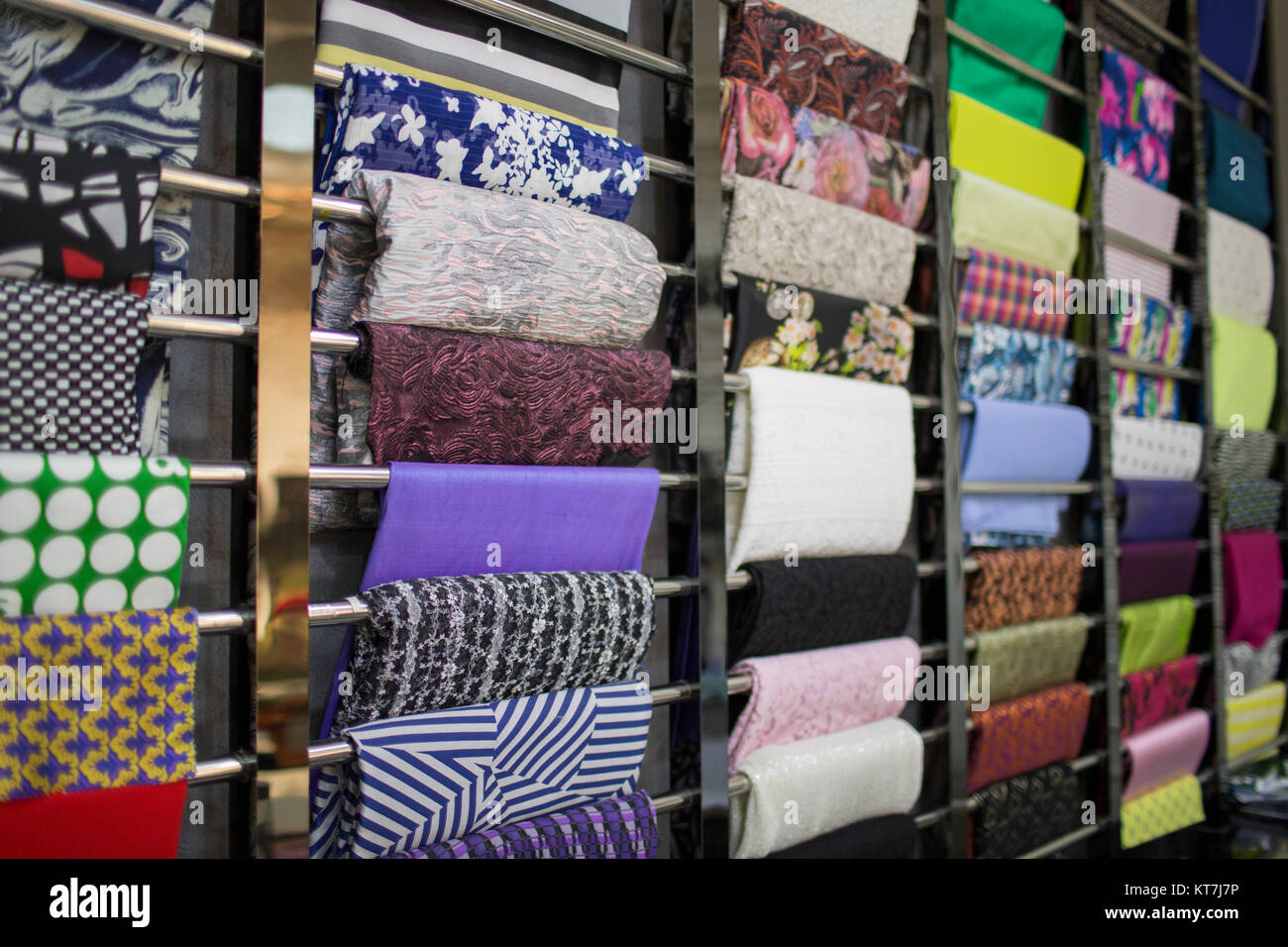 Different fabric swatches hanging on a designer’s material rack Stock ...