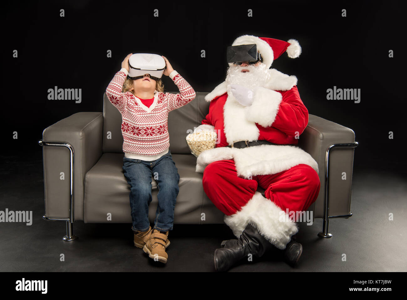 Kid and Santa Claus in virtual reality headsets Stock Photo - Alamy