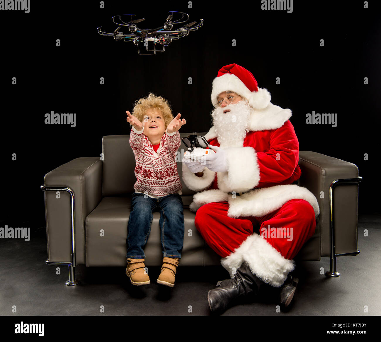 Santa Claus with child using hexacopter drone Stock Photo - Alamy