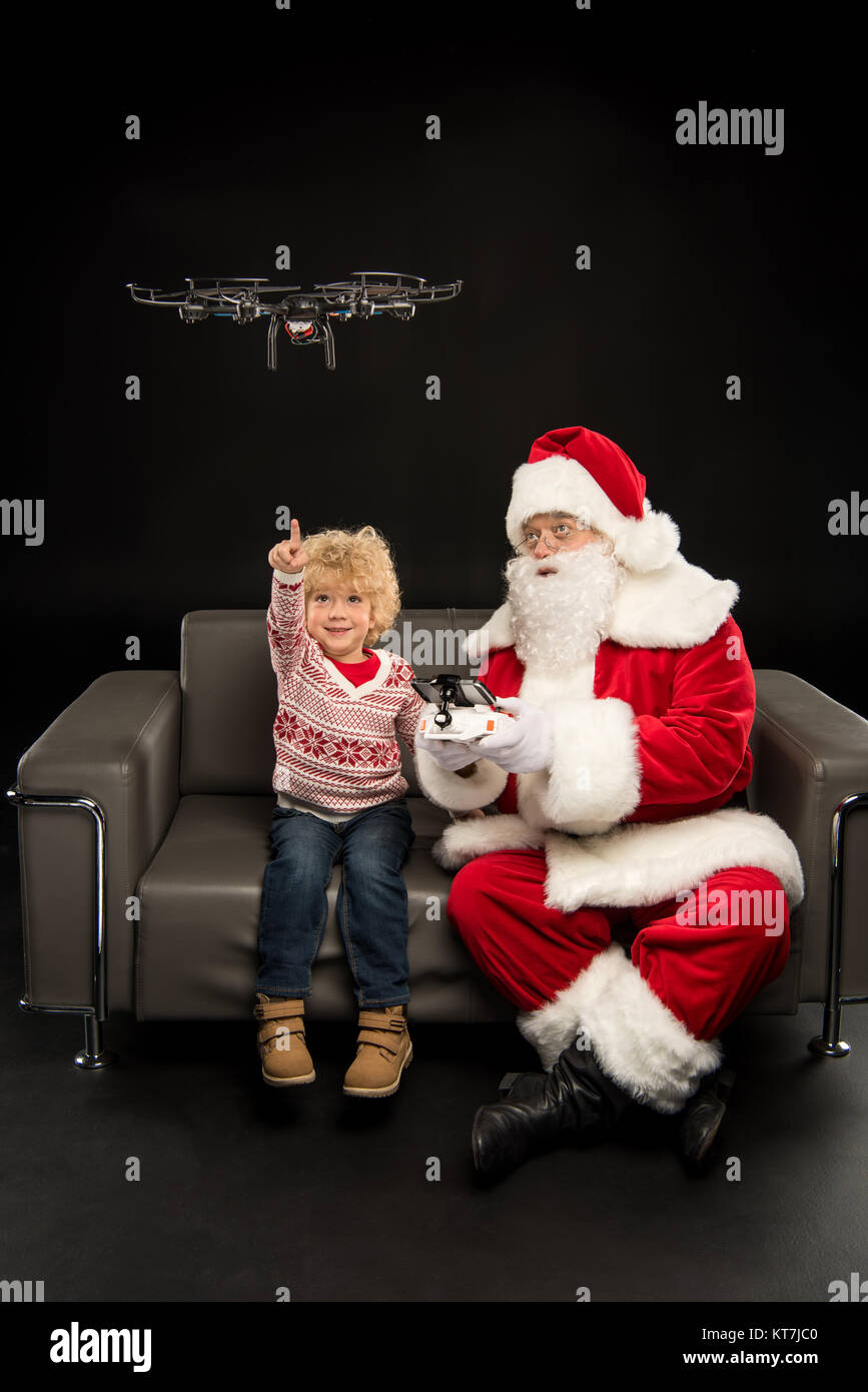 Santa Claus using hexacopter drone with child Stock Photo - Alamy