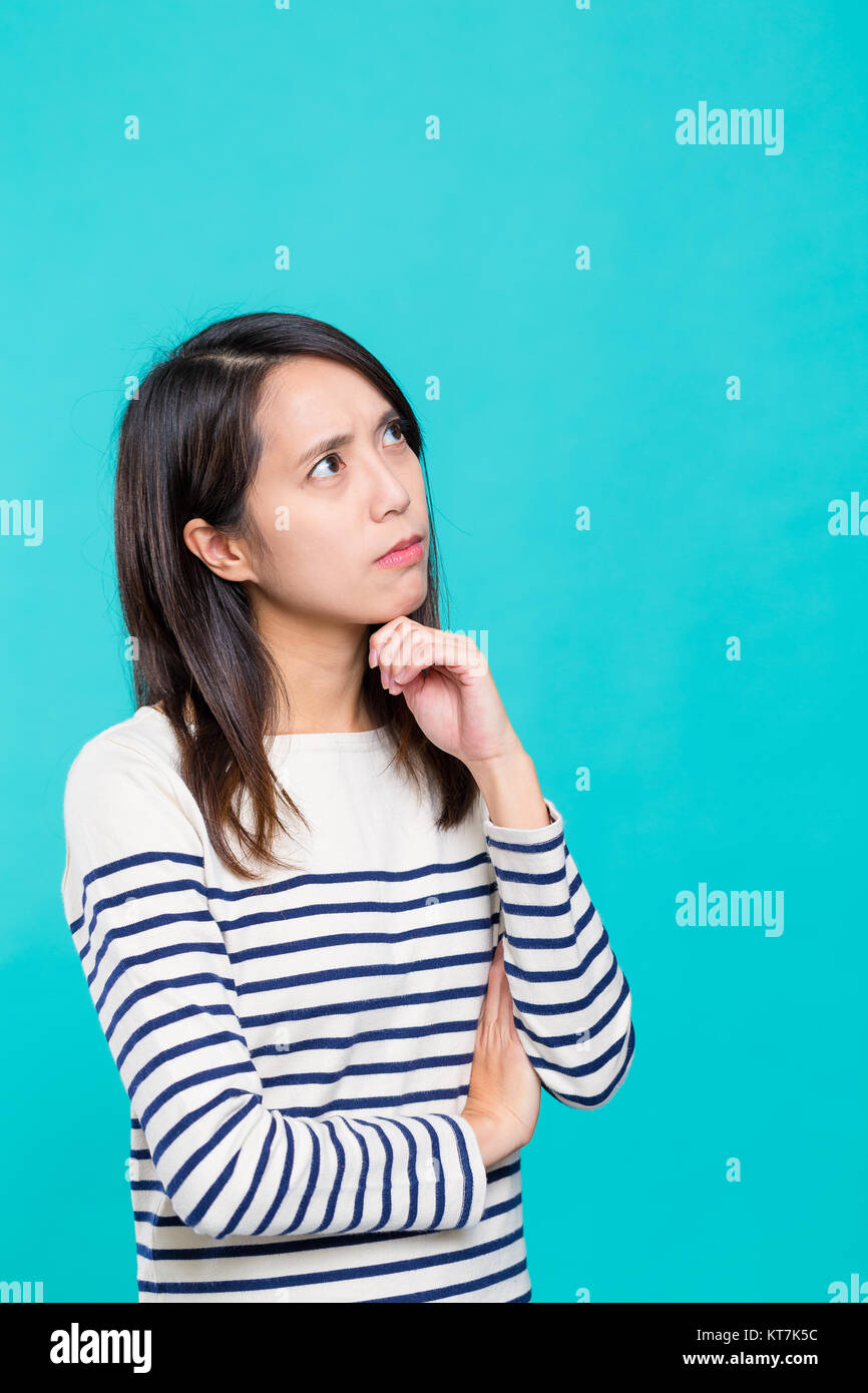 Asian woman thinking of something Stock Photo - Alamy