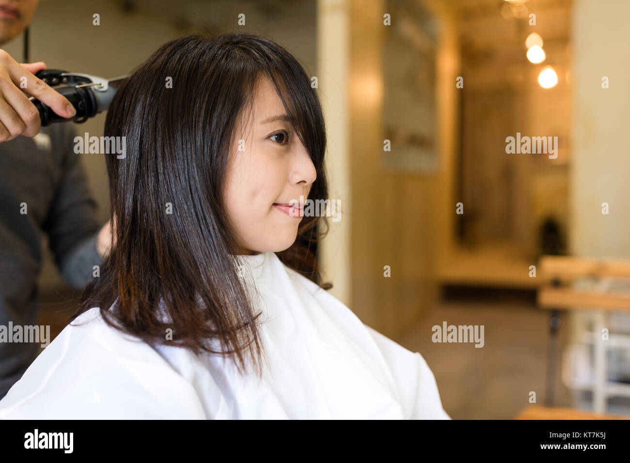 Woman having her hair cut Stock Photo - Alamy