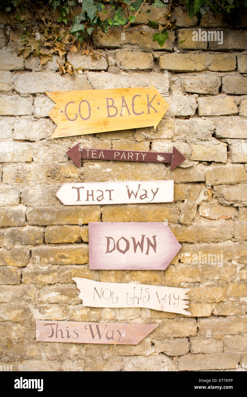 Wooden signs hanging on the Wall Stock Photo - Alamy
