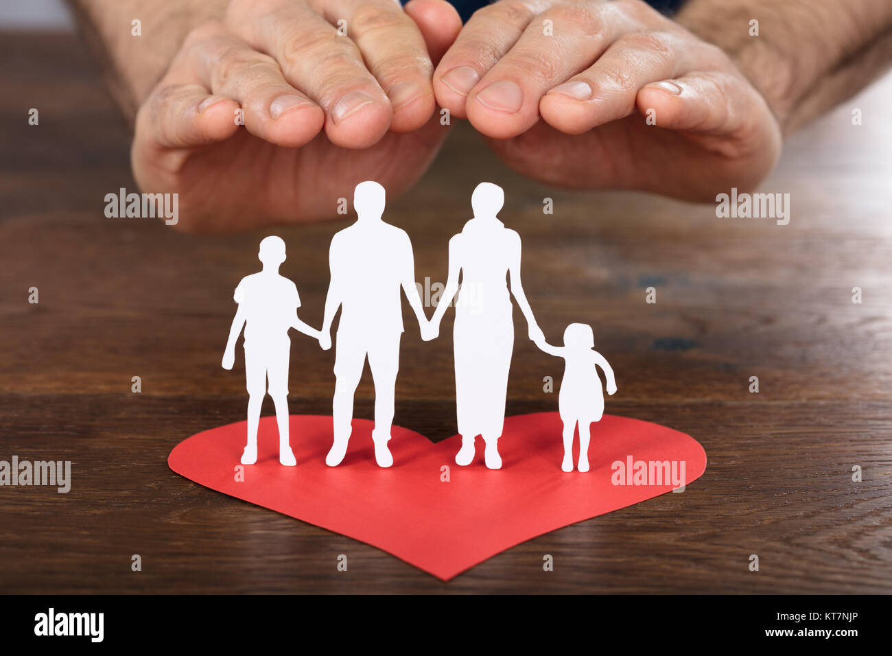 Person Hand Protecting Family Paper Cut Stock Photo - Alamy