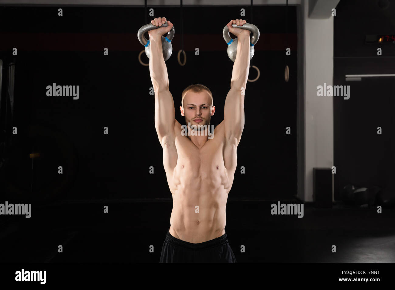 Man Doing Exercise With Kettle Bell Stock Photo - Alamy