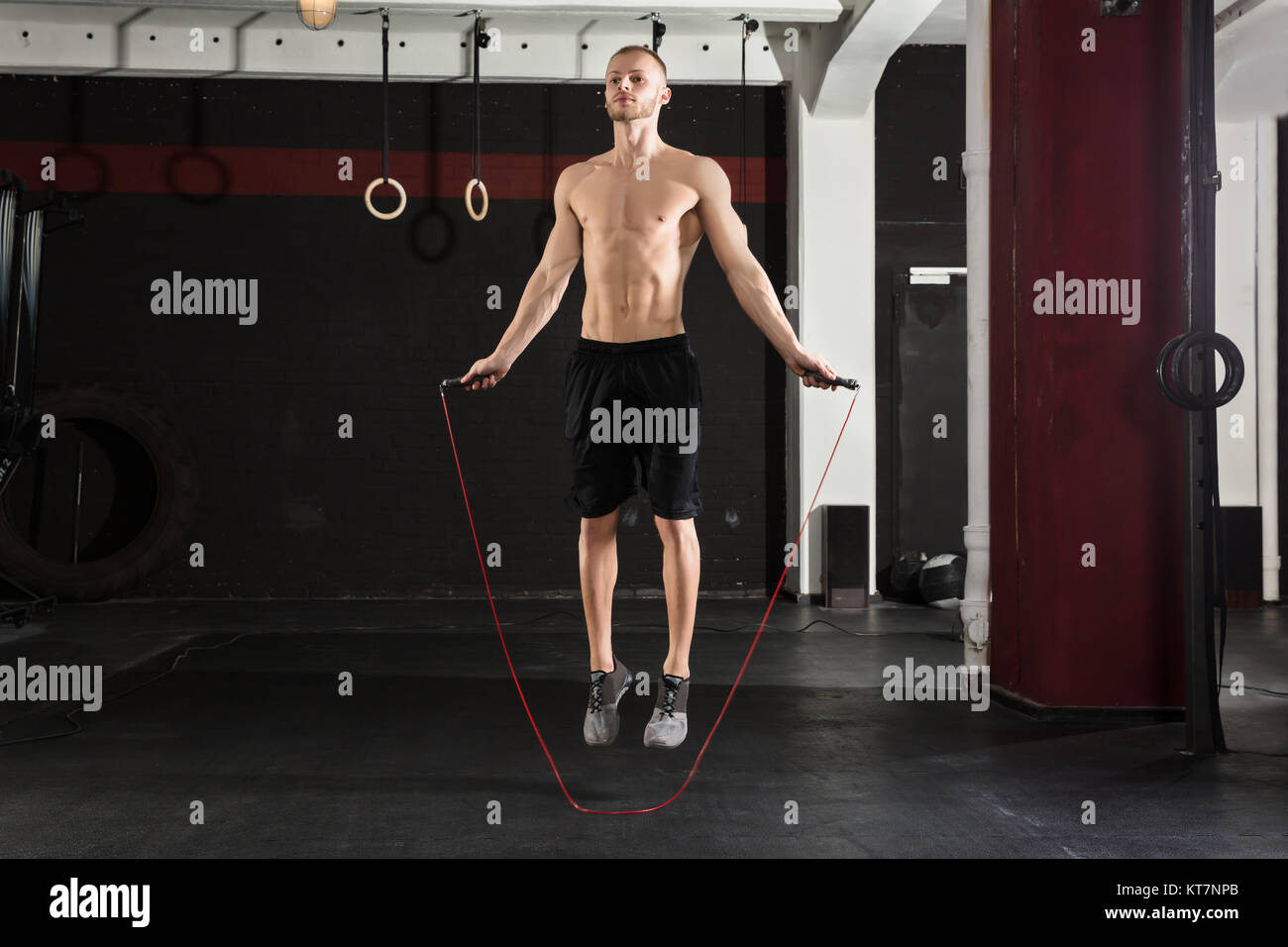 Man With Jumping Rope In The Gym Stock Photo - Alamy